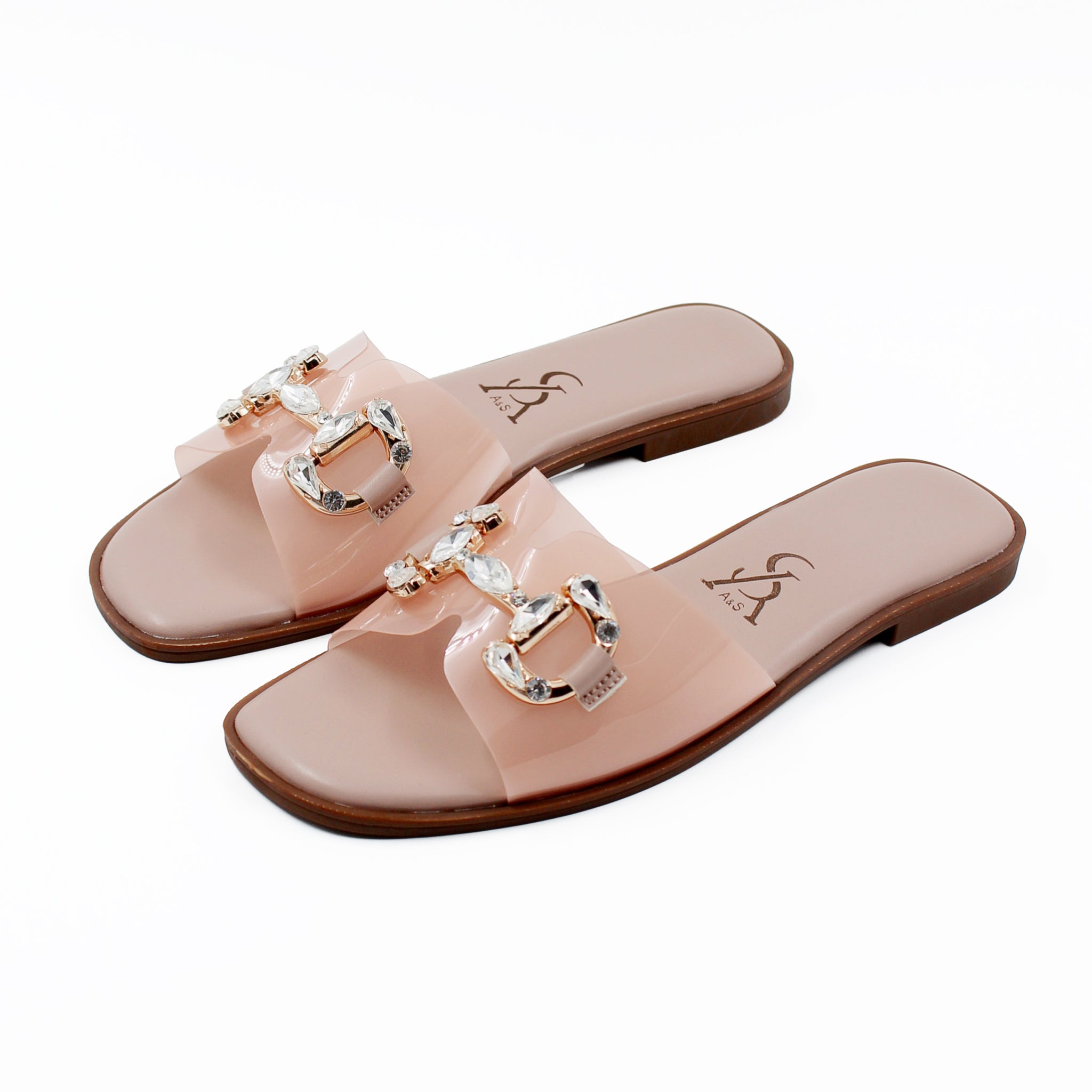 FLAT TRANSPARENT SLIDERS WITH STUDDED BUCKLE.